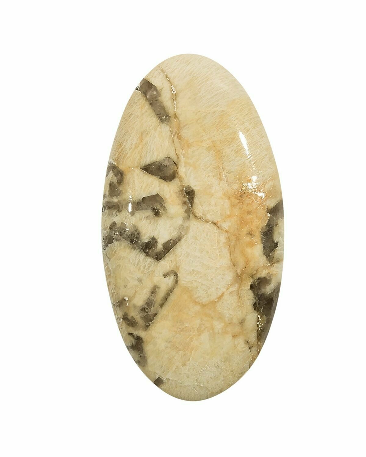 Кабошон из пегматита размером 51х27х7 мм.