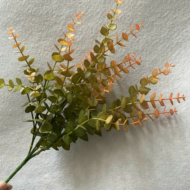 Realistic plastic eucalyptus greenery for wedding centerpieces and events orange