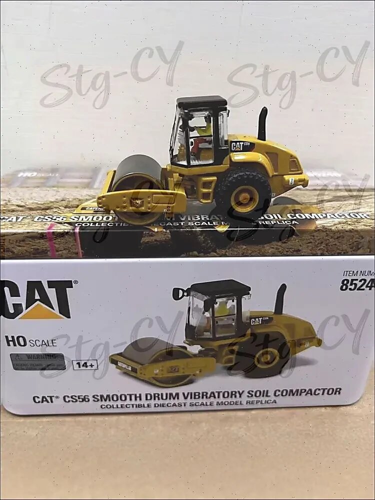 Коллекционная модель катка CAT CS56 в масштабе HO, горчичного цвета