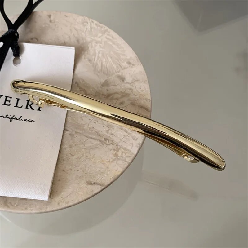 Золотая заколка-планка для волос