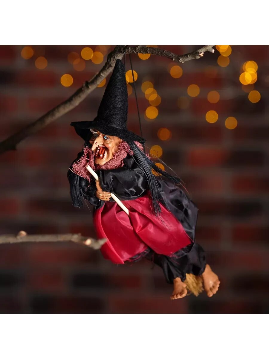 Баба-яга в атласной одежде, висит, музыкальная