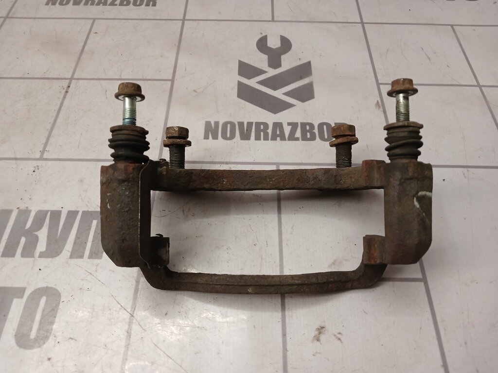 Скоба суппорта переднего Hyundai Elantra 3 00-05