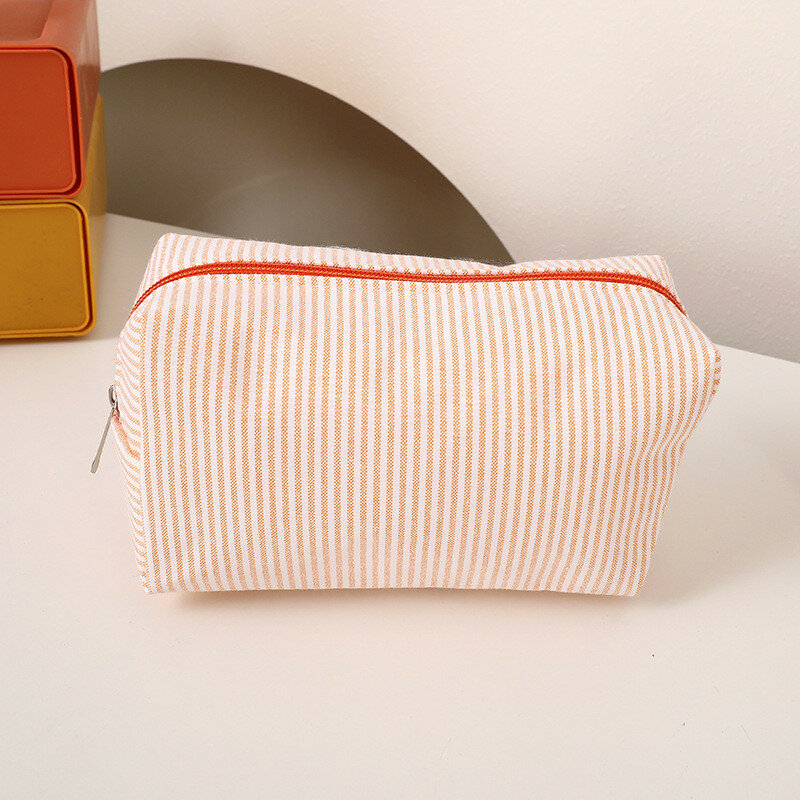 Stylish geometric triangle stationery pouch with striped material for students and office orange