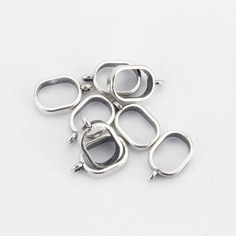 Плоские металлические бусины SunMoon 10x6 мм 20 шт antique silver color