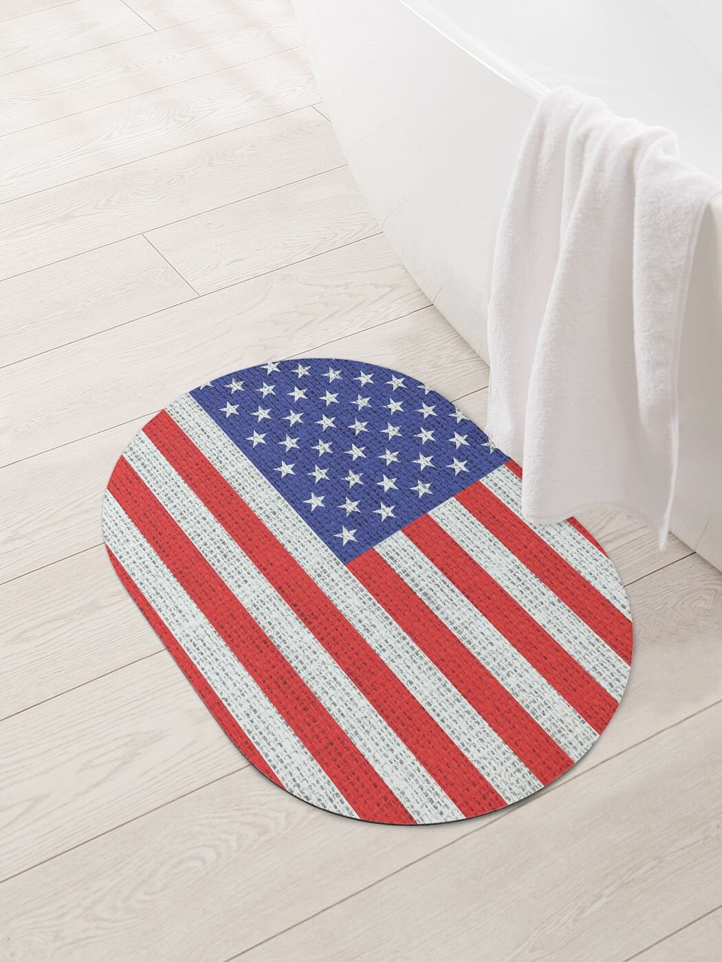 Коврик для ванной и туалета овальный противоскользящий JoyArty "Вышитый американский флаг" 58x38 см