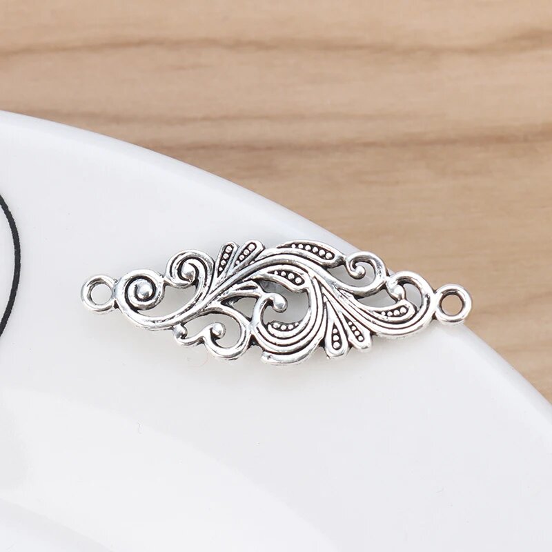 Тибетские серебряные подвески Феникс 50 шт.