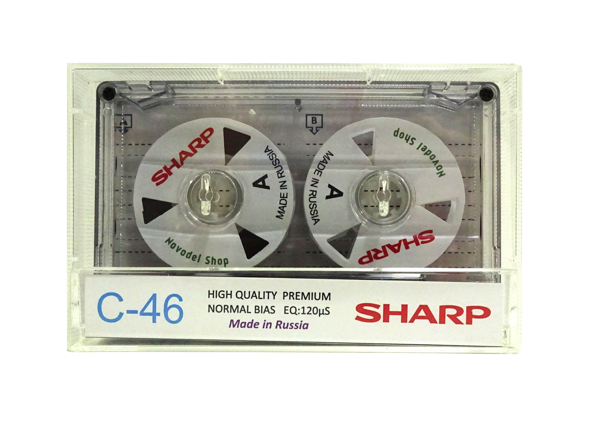 Аудиокассета "SHARP С-46" c белыми боббинками и с логотипом "Novodel Shop"