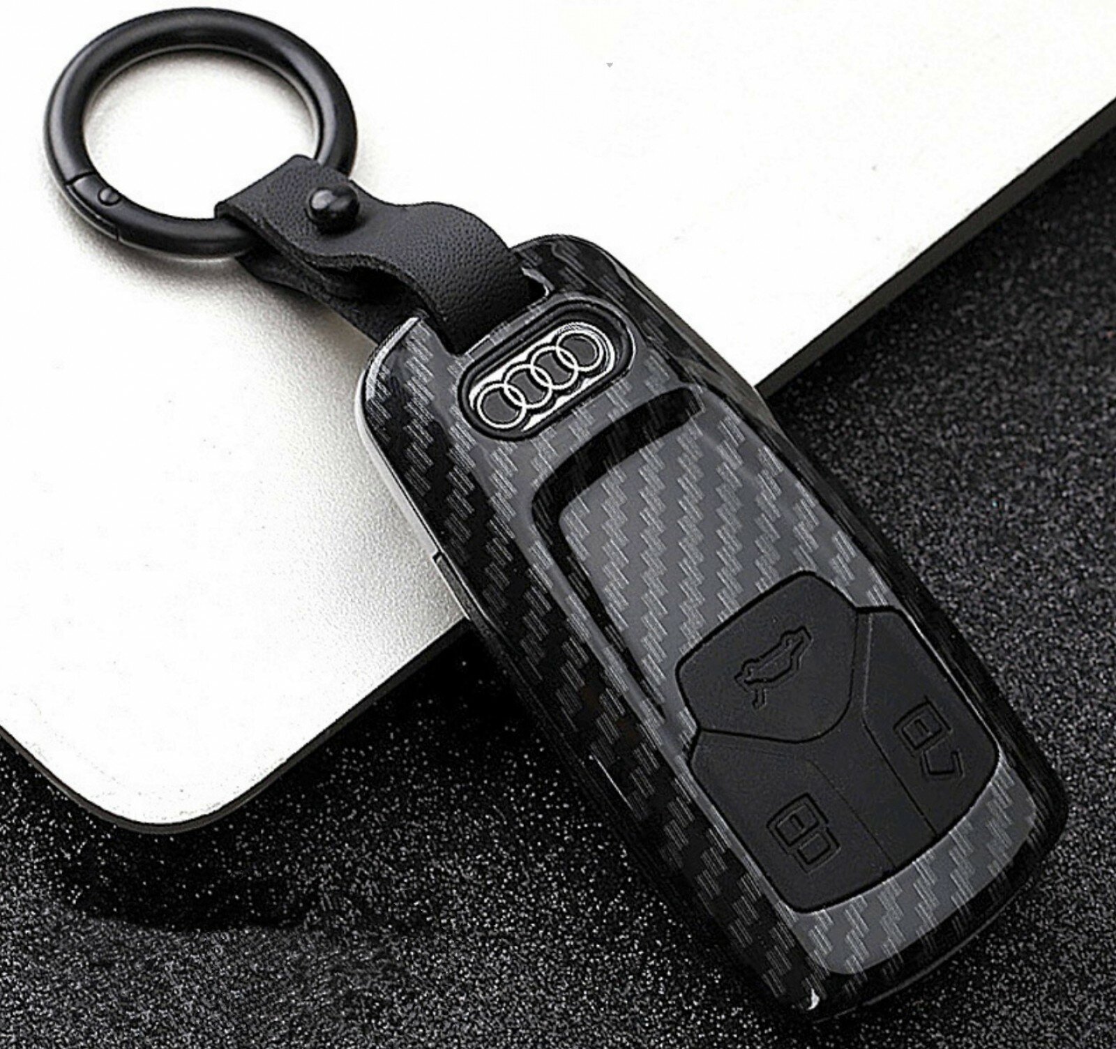 Защитный черный чехол MyPads M-236659 для смарт ключа Audi с карбоновым рисунком и брелоком