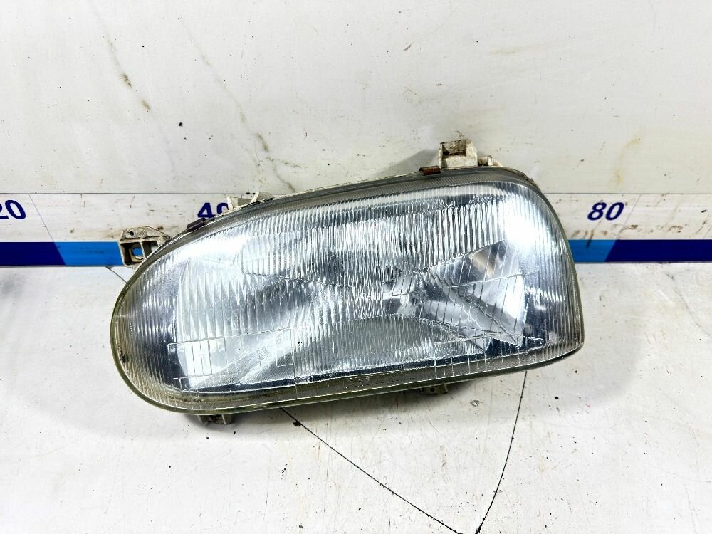 Фара левая VW Golf III 4411111LLDE