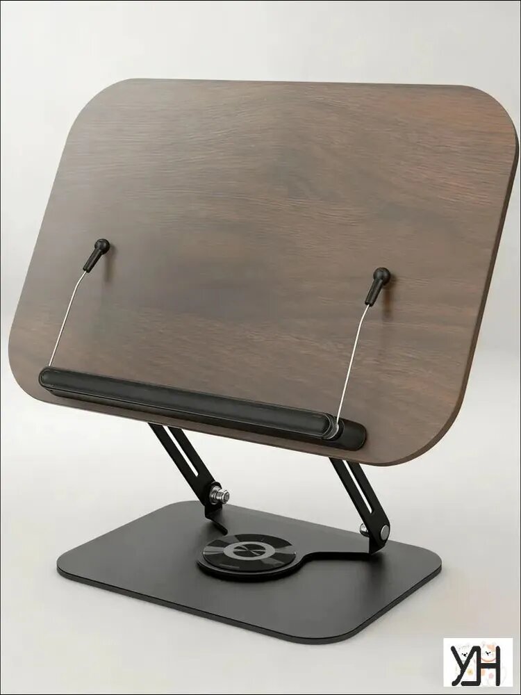 Может подниматься и опускаться, поворачиваться на 360 градусов, подставка для чтения.