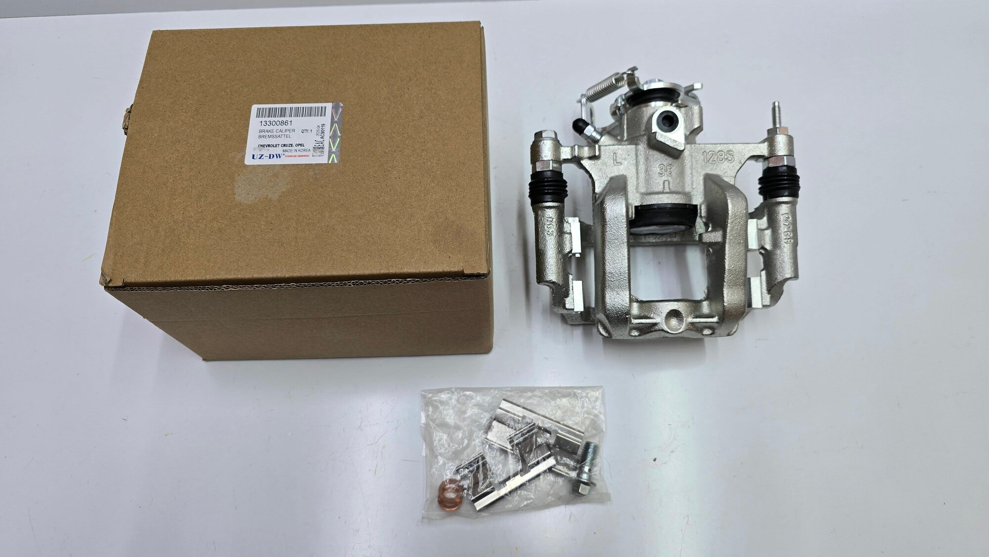 Суппорт задний левый в сборе со скобой Круз, Опель