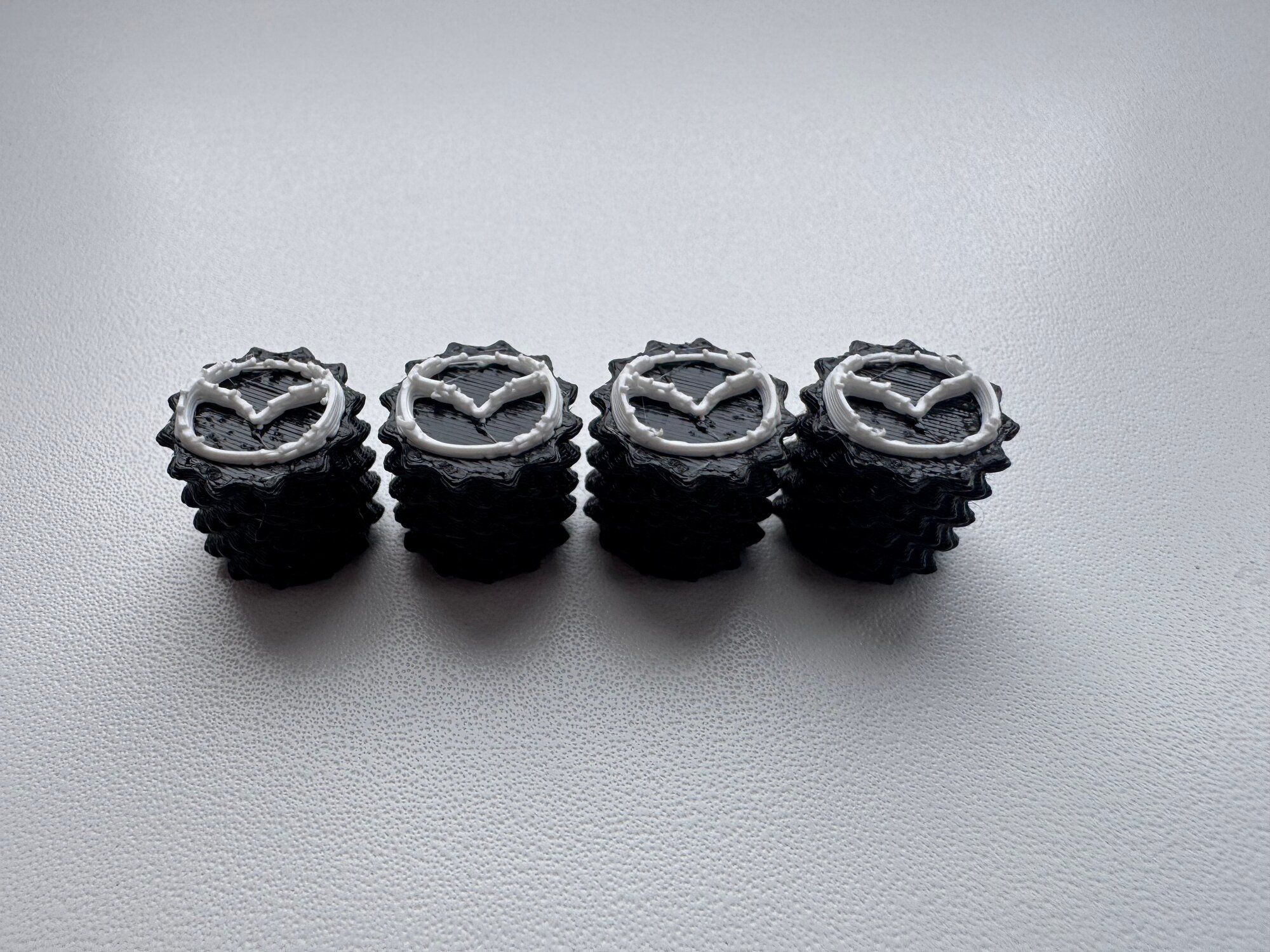 Колпачки на ниппель Mazda / Мазда, черные, пластик, Комлект - 4 шт.