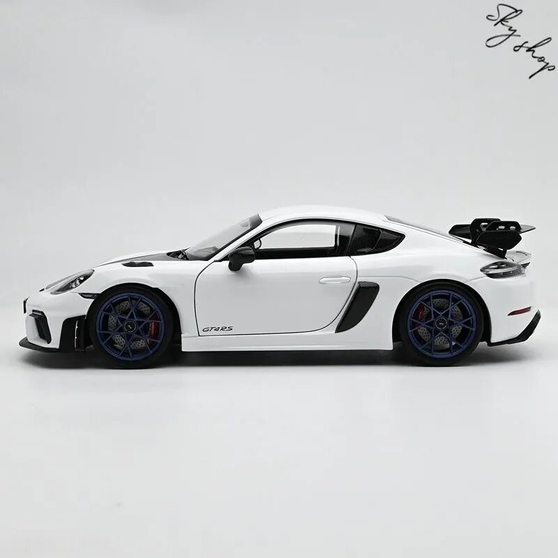 Игрушечная машинка Porsche 718 Cayman GT4 RS, масштаб 1:10, белого цвета, открывающиеся двери и капот — фото 1