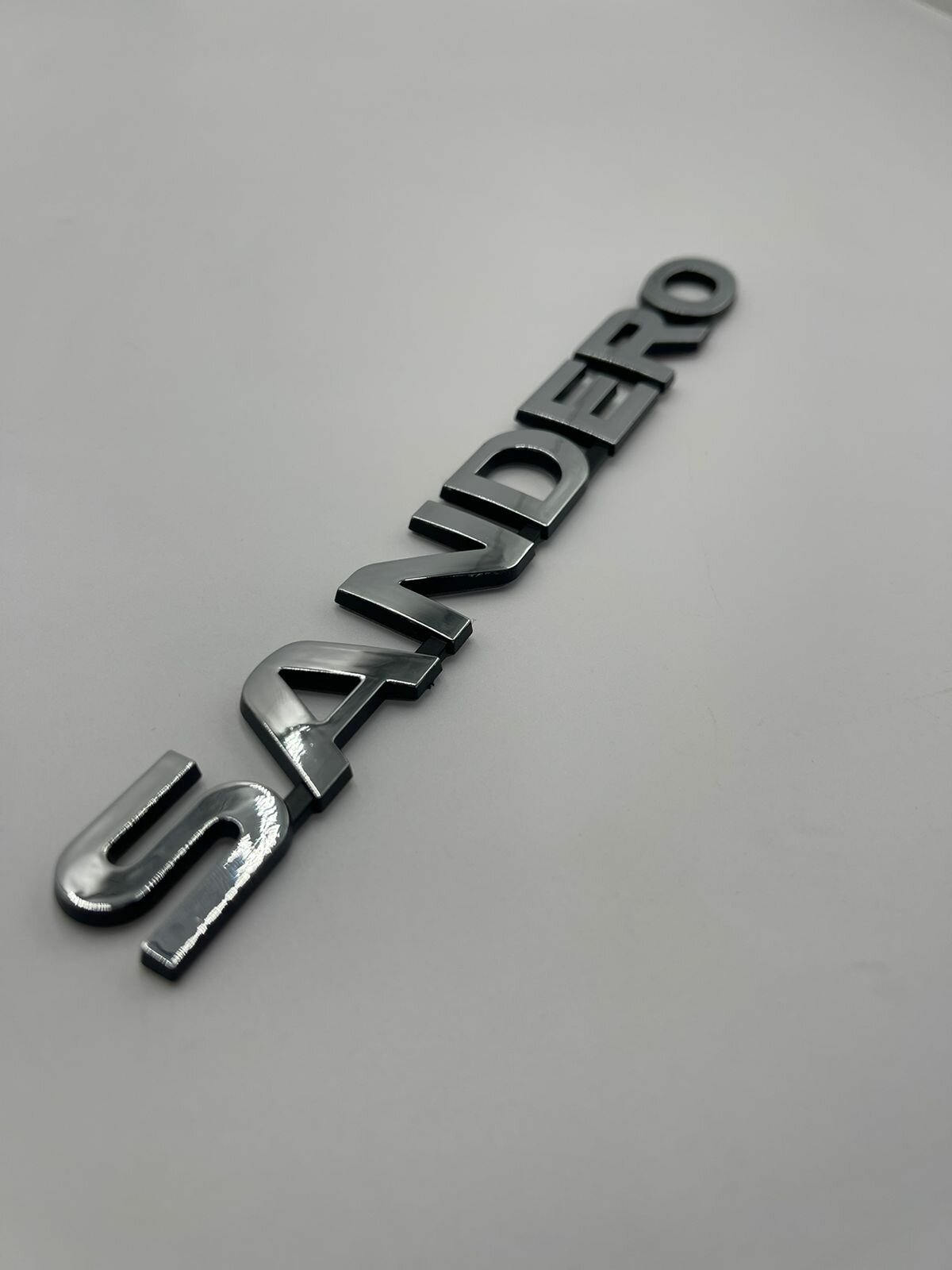 Надпись Наклейка знак Шильдик Sandero Хром 22см