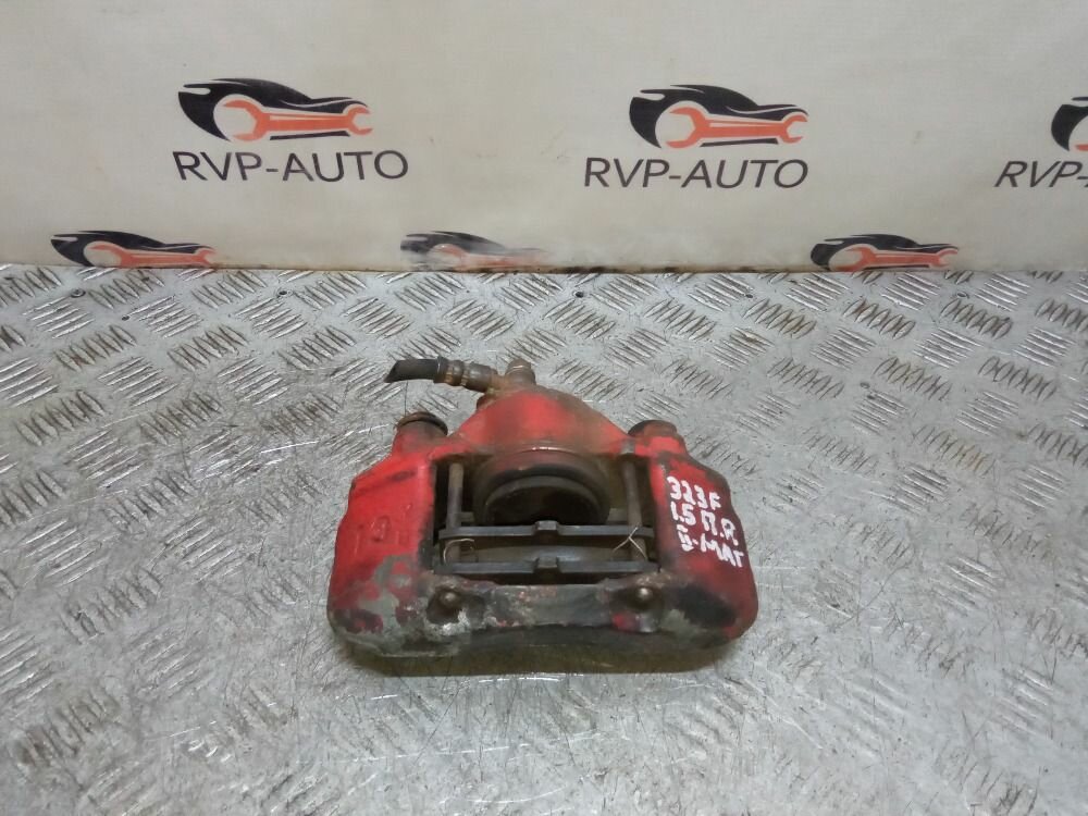 Суппорт передний правый Mazda 323F BA 1994-98