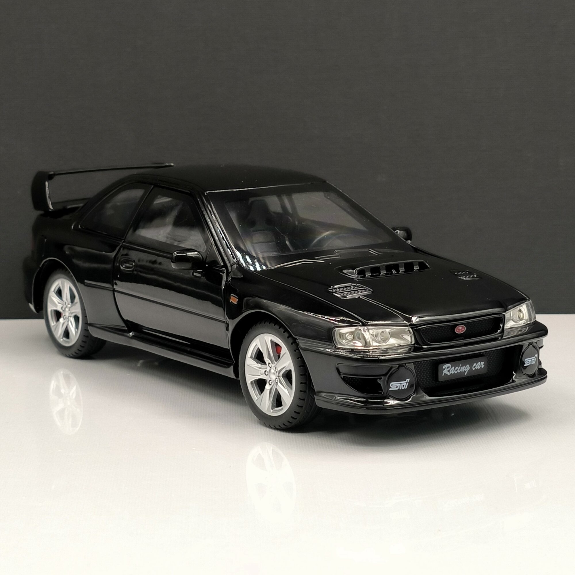 Металлическая машинка Subaru Impreza WRX STI с инерционным механизмом и свето-звуковым сопровождением. Масштаб 1:24