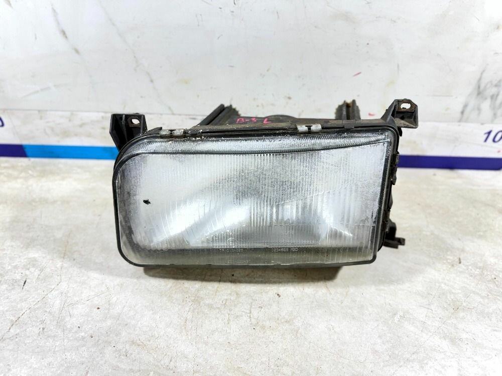 Фара левая VW Passat B3 357941017