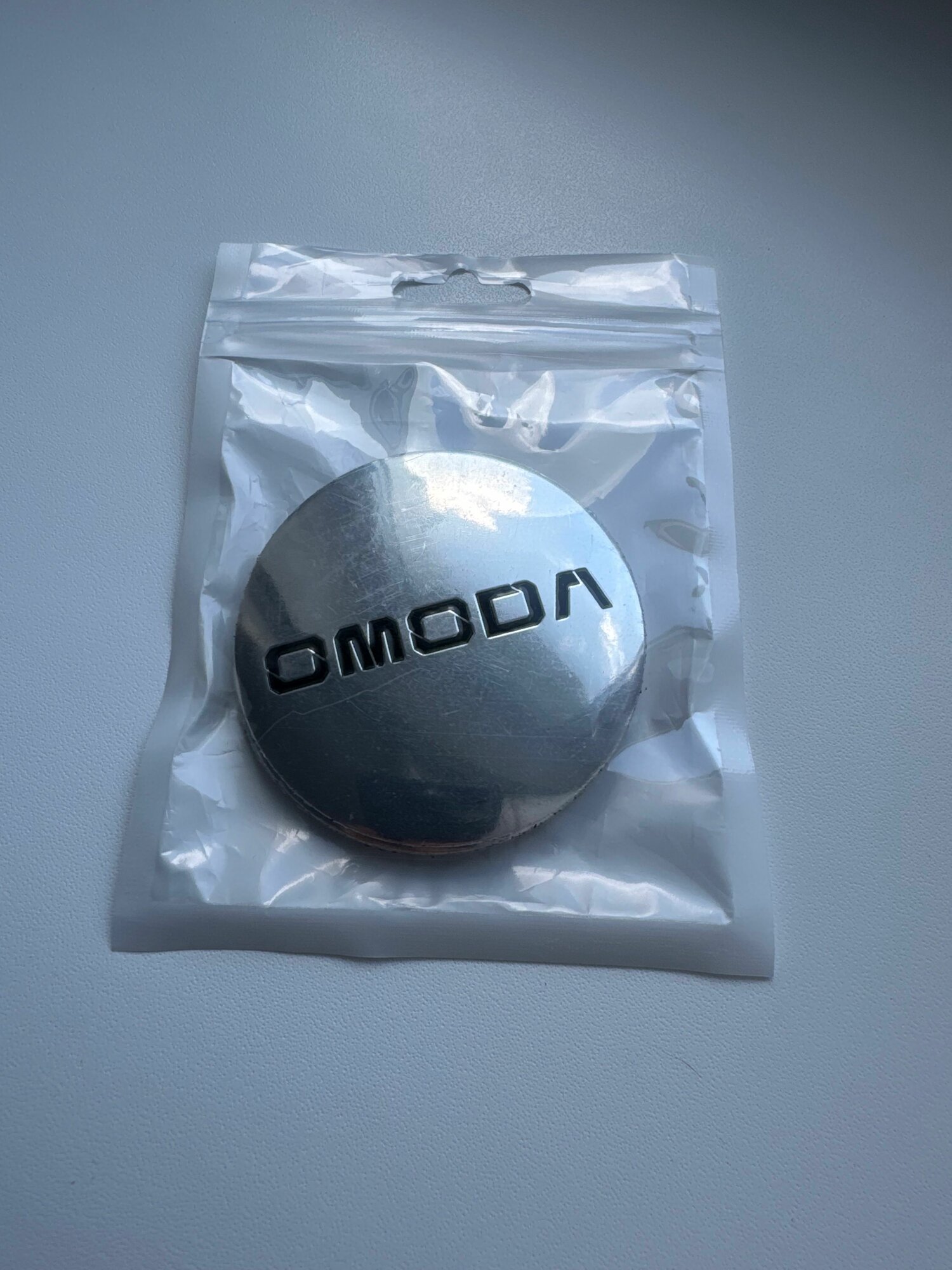 Наклейки на колесные диски и колпаки Omoda Омода , D 60 mm, серебристые