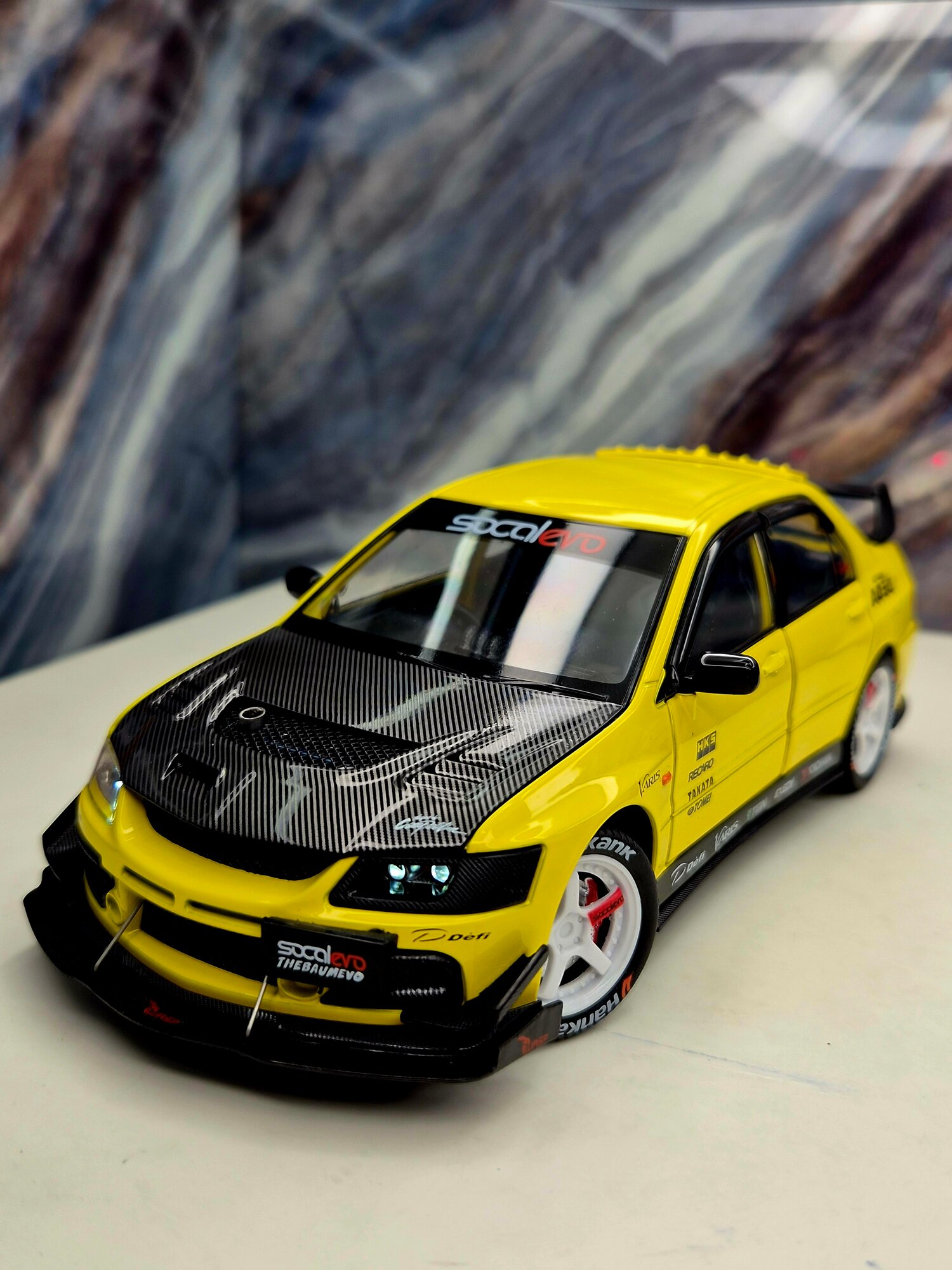 Коллекционная машинка игрушка металлическая Mitsubishi Lancer Evolution EVO9 масштаб 1:24 желтый