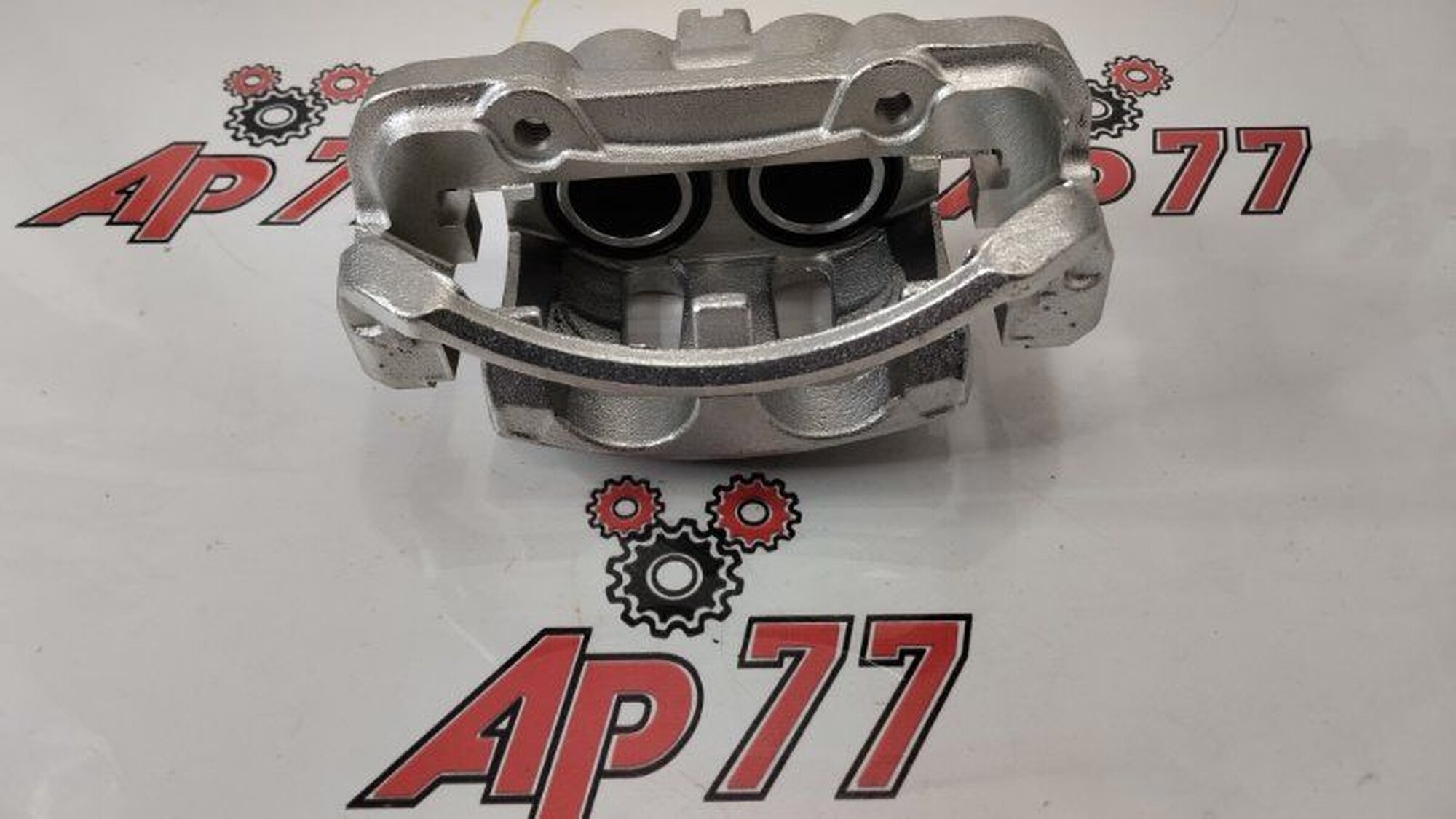 Суппорт Nissan Datsun BD22 FL 2 поршневой 4101157G00 передний левый