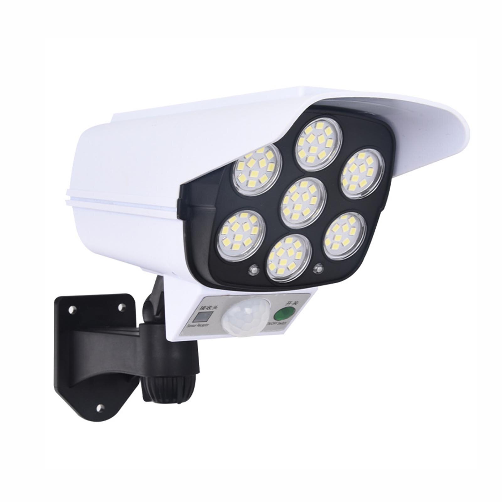 Солнечная сенсорная настенная лампа имитация камеры LED 77LEDs 6000-6500K IP65 с пультом управления 3-5м 10W 3.6V 1200mAh 20*10*8cm 405g для гаража крыльца террасы