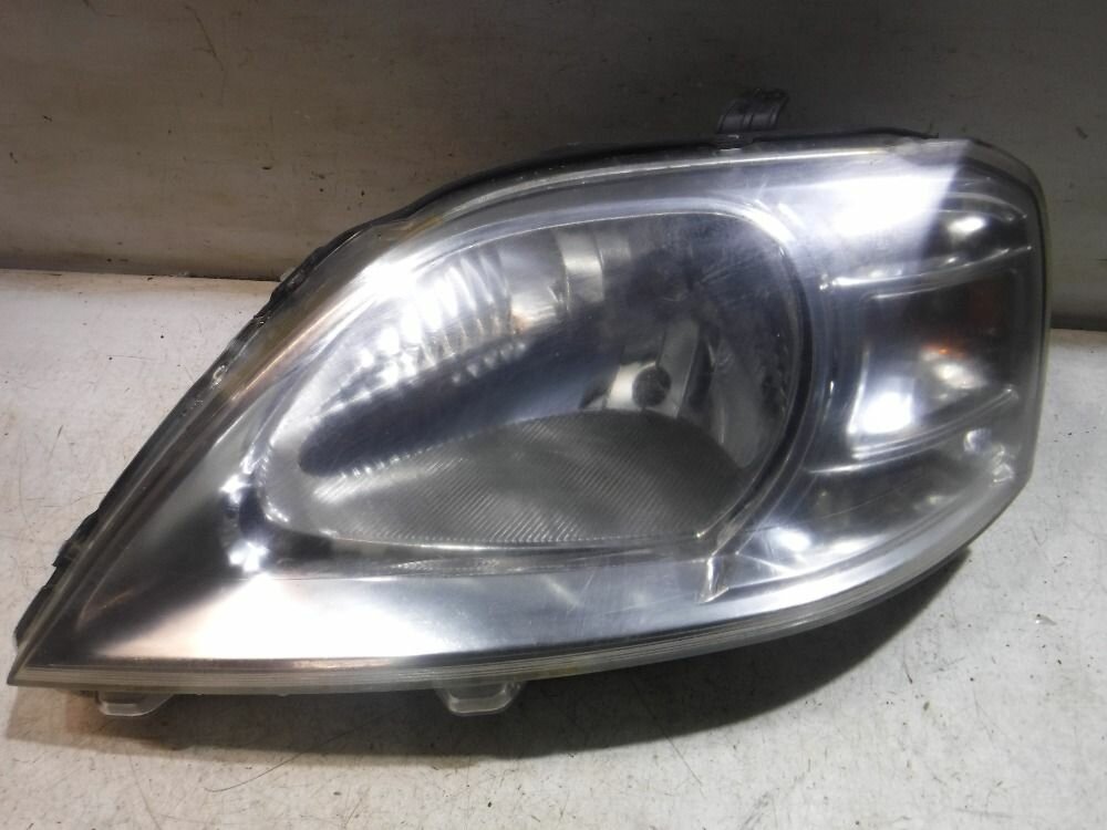 Фара левая Renault Logan I 6001546788