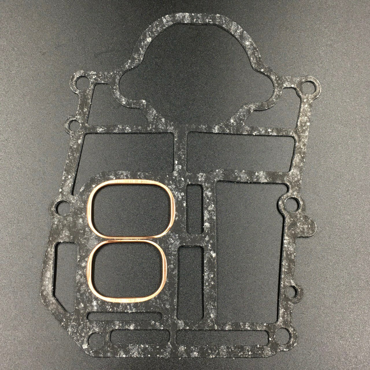 Прокладка под блок Tohatsu 25-30 (Omax) OEM номера: 346-01303-0