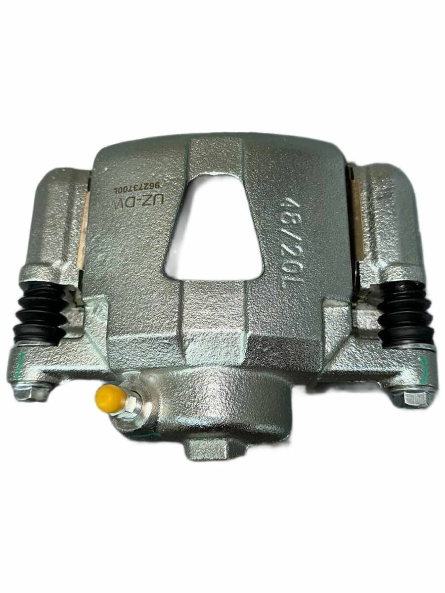 Суппорт в сборе на Daewoo Nexia SOHC Левый UZ-DW