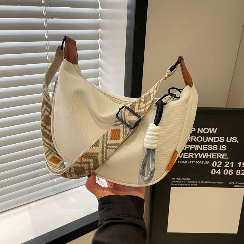 Женская сумка 2025 года, новая модель из оксфордской ткани, сумка-пельмень, повседневная спортивная сумка с большой вместимостью, широким плечевым ремнем, сумка через плечо для женщин.