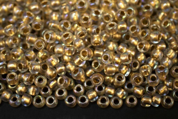 Бисер японский TOHO круглый 6/0 #0994 хрусталь радужный, золотая линия внутри, 10 грамм