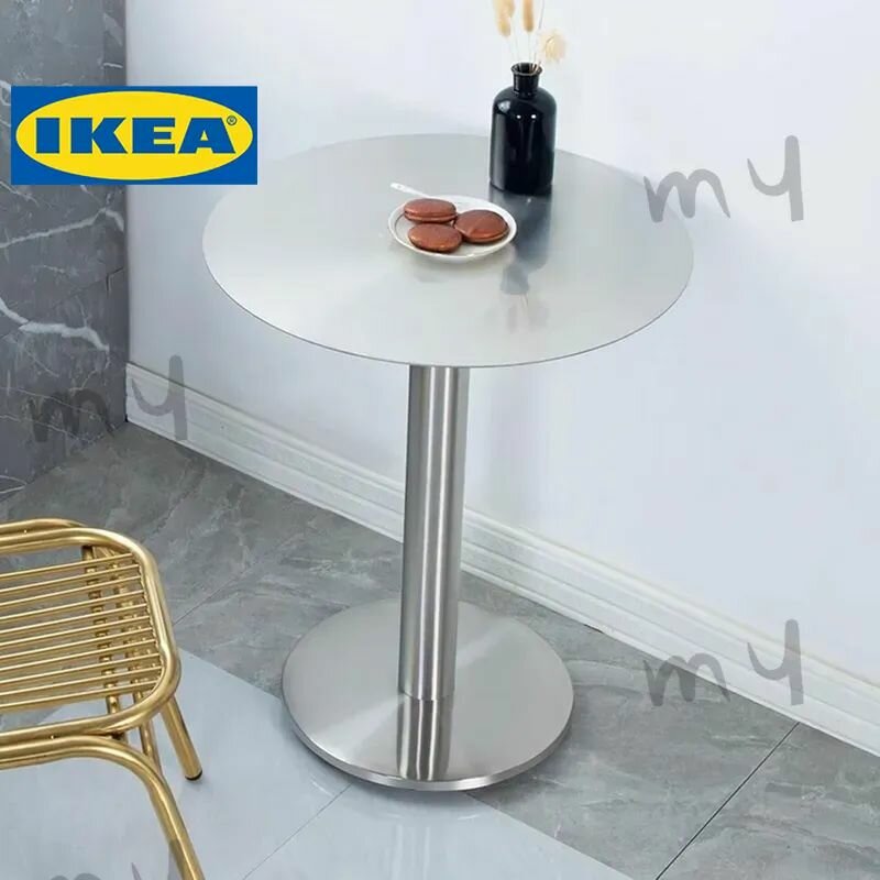 Маленький круглый столик из нержавеющей стали