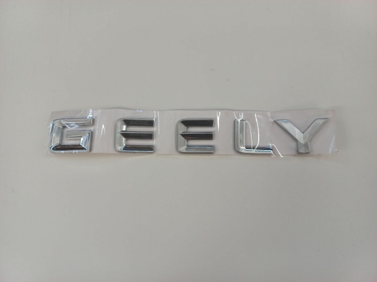 Эмблема "Geely" Geely Atlas [2.4 16V 6AT внедорожник 4X4] 1018059237