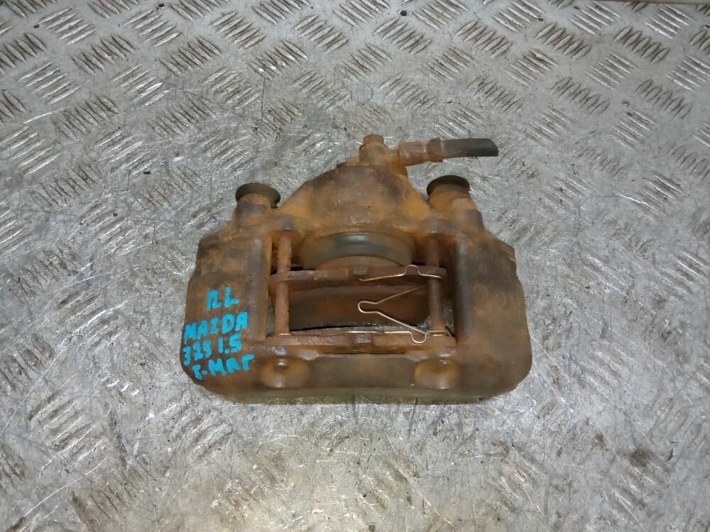 Суппорт передний левый Mazda 323 BA 1994-1998