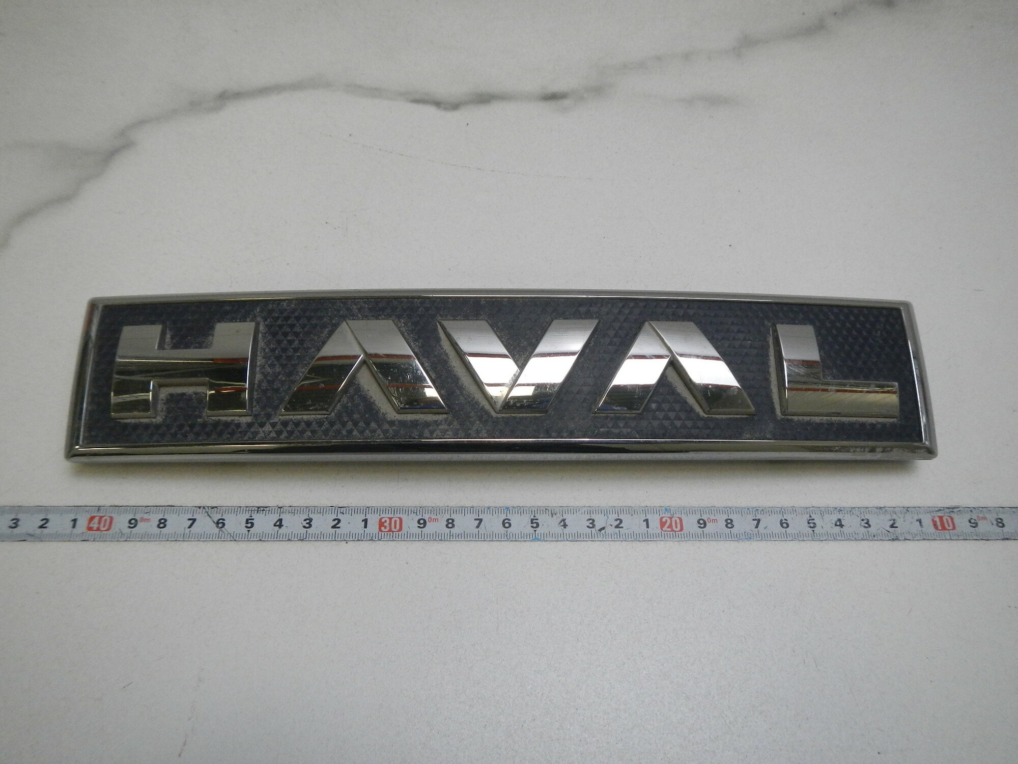 Б/У Эмблема, Haval (Хавейл)-JOLION (21-) Haval JOLION (21-) 24- Царапины. 648099 HAVAL арт. 3921103XKN01A