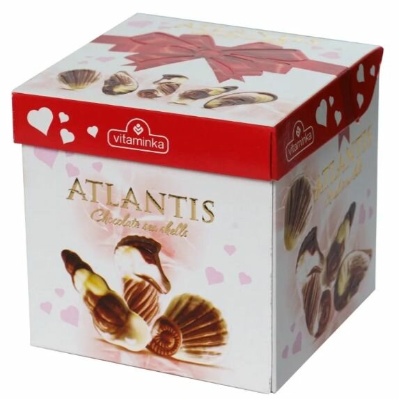 Конфеты ATLANTIS Бант морские ракушки из молочного и белого шоколада с ореховым кремом /картон/ 93г