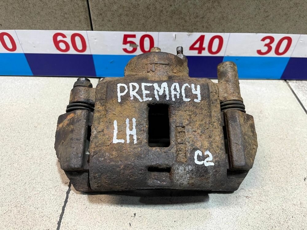 Суппорт передний левый Mazda Premacy