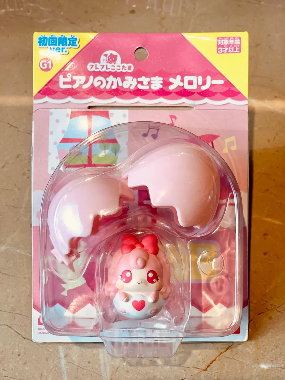 Cocotama Яйцевая статуэтка-неваляшка с маленькой книжкой - Тема хорошего настроения, 1 (Пыль на коробке)