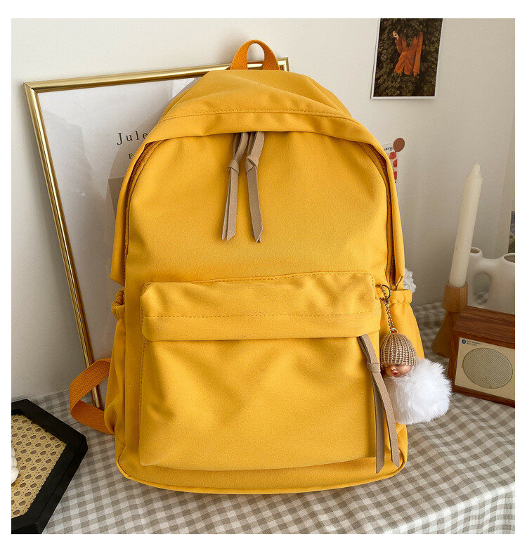 Fashion forward nylon backpack for college students with pouch and internal storage, yellow