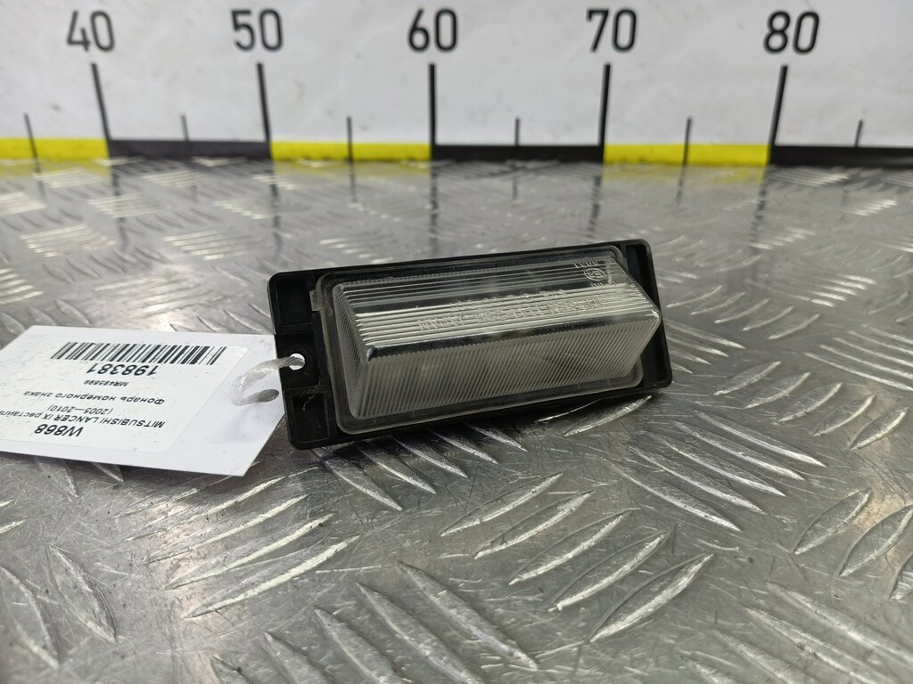 Фонарь номерного знака Б/У для MITSUBISHI LANCER IX рестайлинг (2005—2010) MR485699