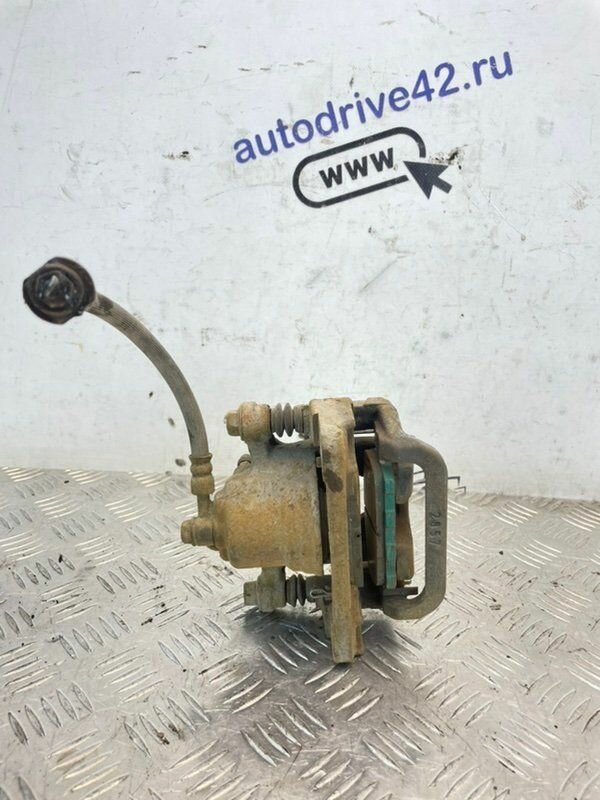 Суппорт тормозной Nissan Qashqai 2008 44011EM11A J10 MR20DE, задний левый (с пробегом)