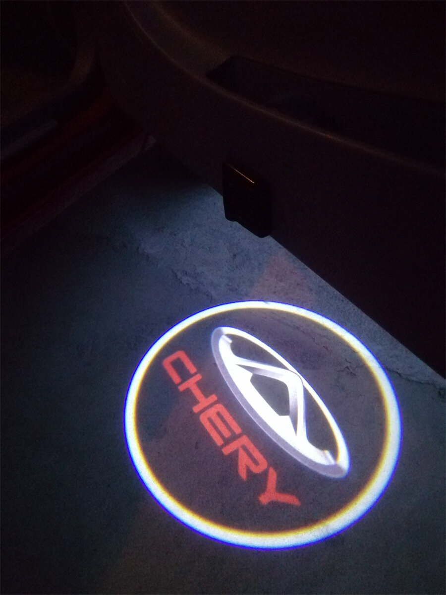 Слайд-логотип 13 мм для проекции в дверь Chery: линза для штатной подсветки Чери (лого Тигго), комплект 2 шт.