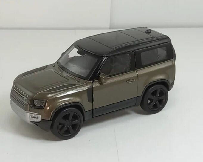 Игрушка Welly Машинка 1:38 Land Rover Defender 2020, пруж. мех, коричневый металлик