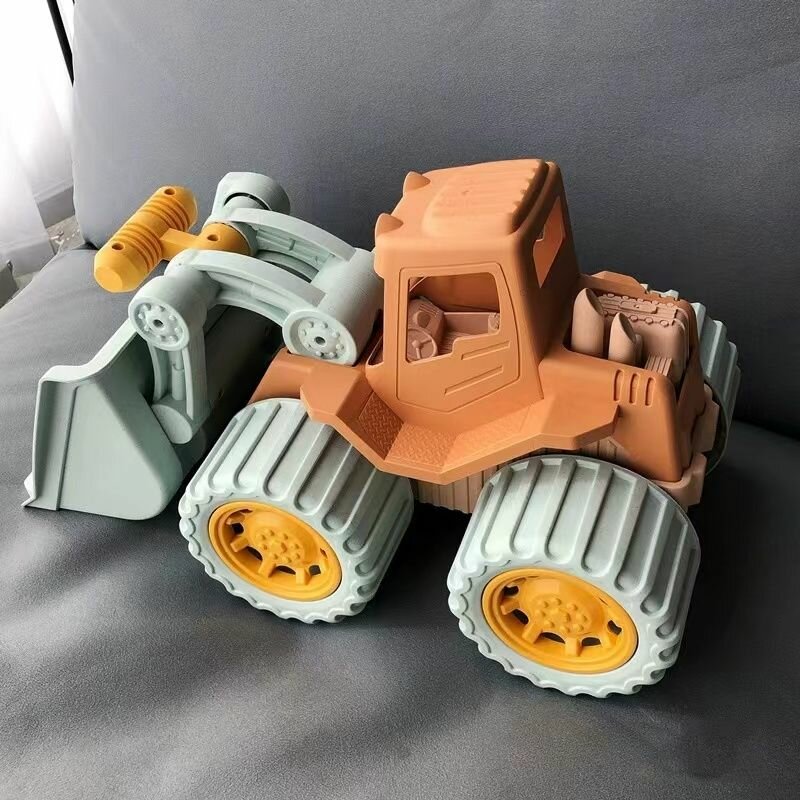 Пляжные игрушки, песочные наборы, песочные часы, инженерные машины, толкающие лопаты, дети, играющие со снегом.