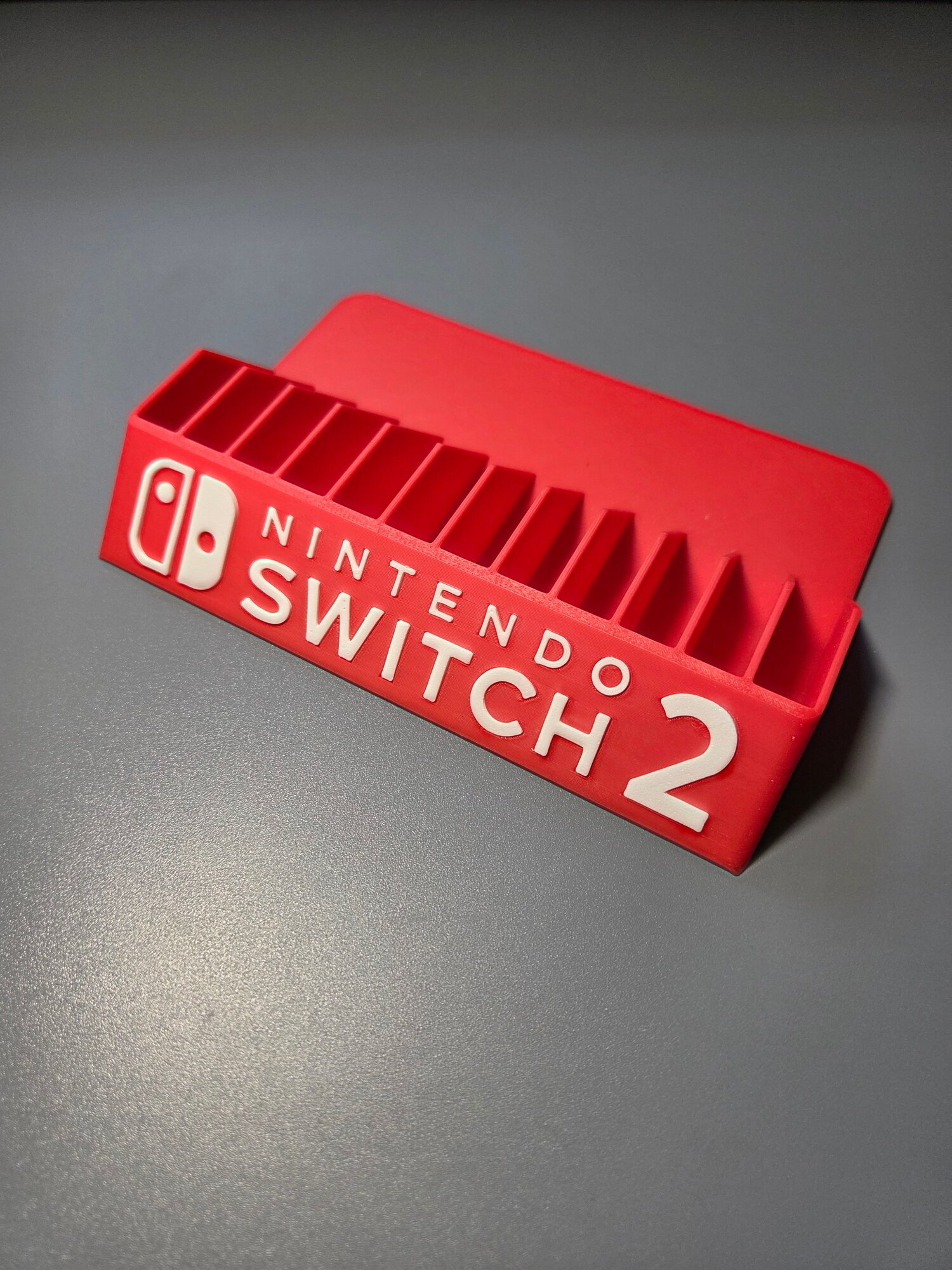 Подставка для картриджей Nintendo Switch 2 красная с белой надписью на 12 игр