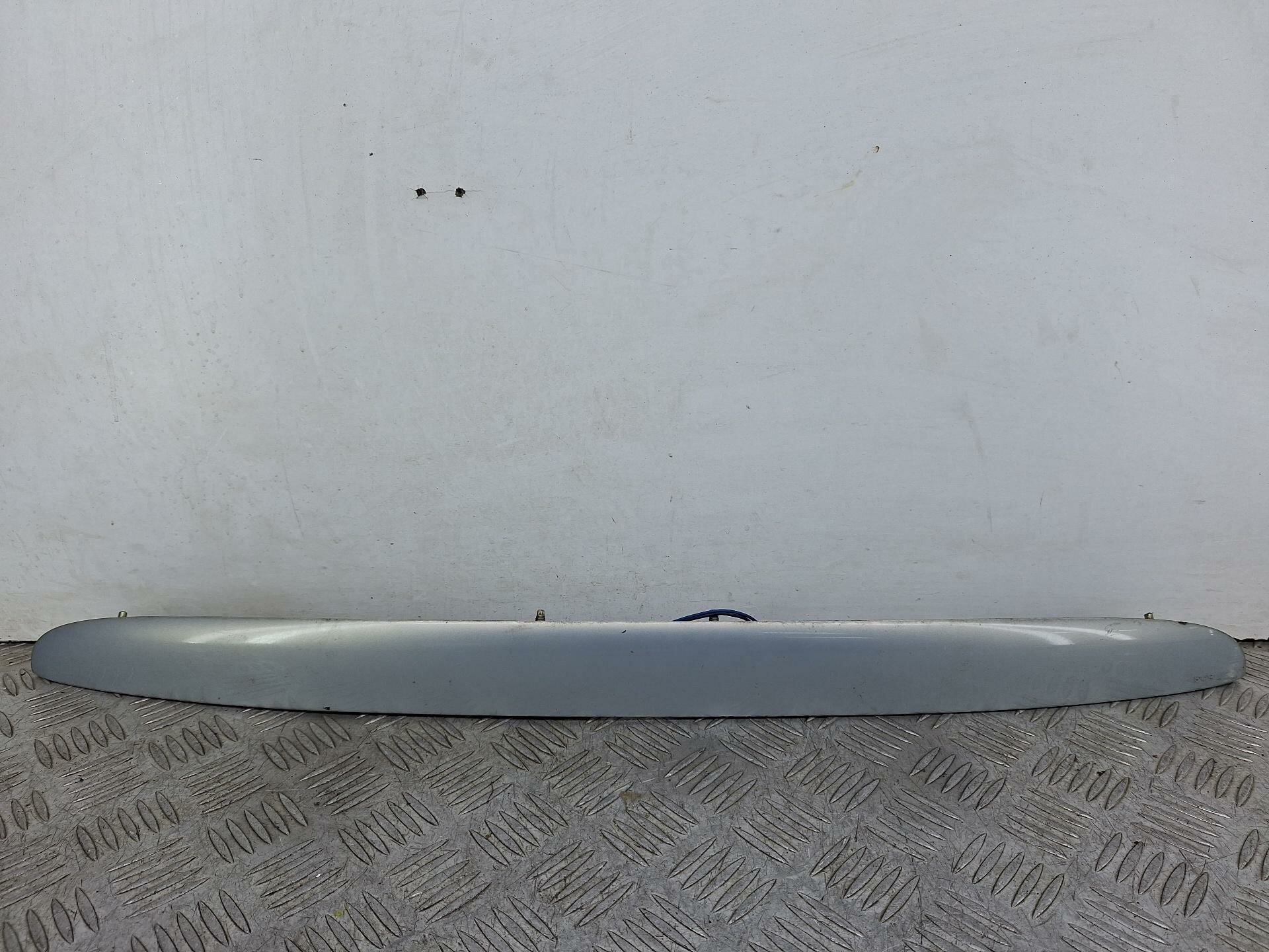 Накладка подсветки номера Renault Scenic рест. (1999 - 2003) 7700428465