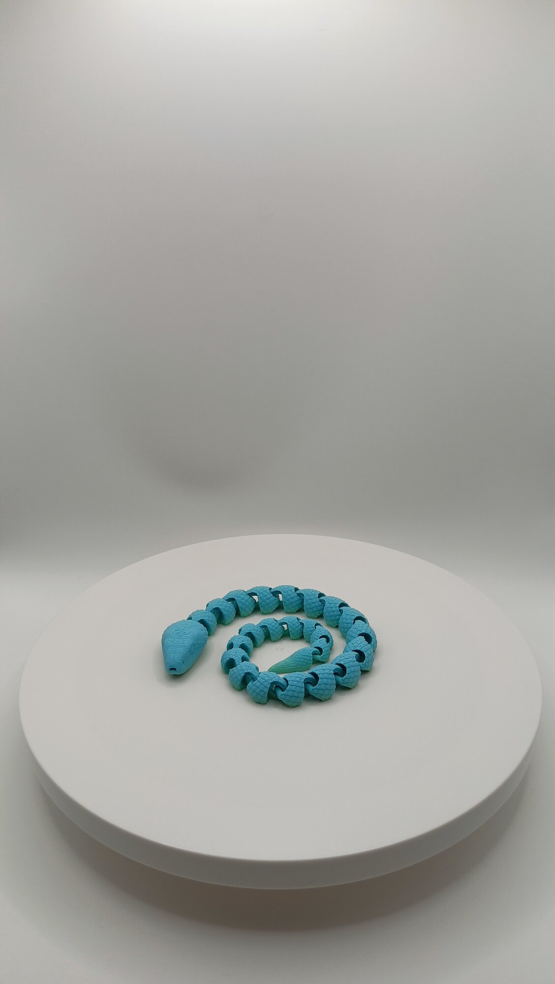 Игрушка антистресс "Змея", длина 36 см, пластиковая, матовая, голубая.