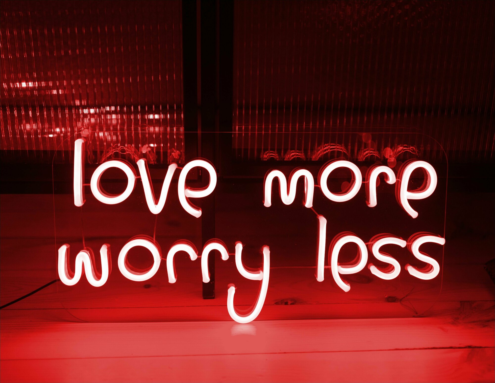 Табличка неоновая love more worry less 60x30 см, красная