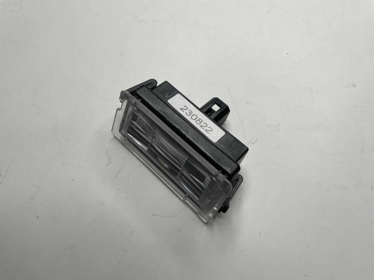 Фонарь подсветки номерного знака KAIYI E5 [1.5 16V 5MT седан Turbo] FX11410810001AA