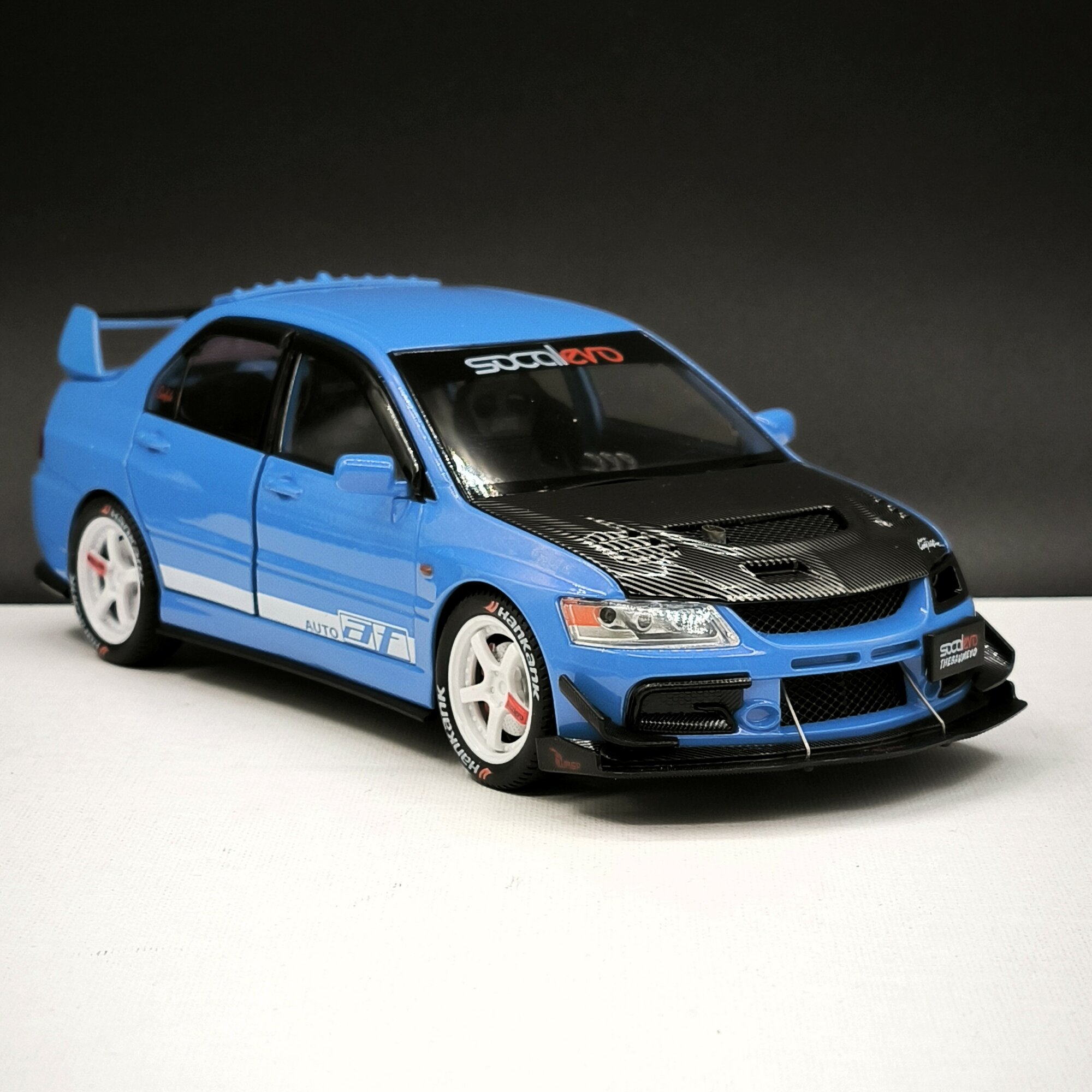 Машинка металлическая Mitsubishi Lancer Evolution с инерционным механизмом и Свето-Звуковым сопровождением. Масштаб 1:24