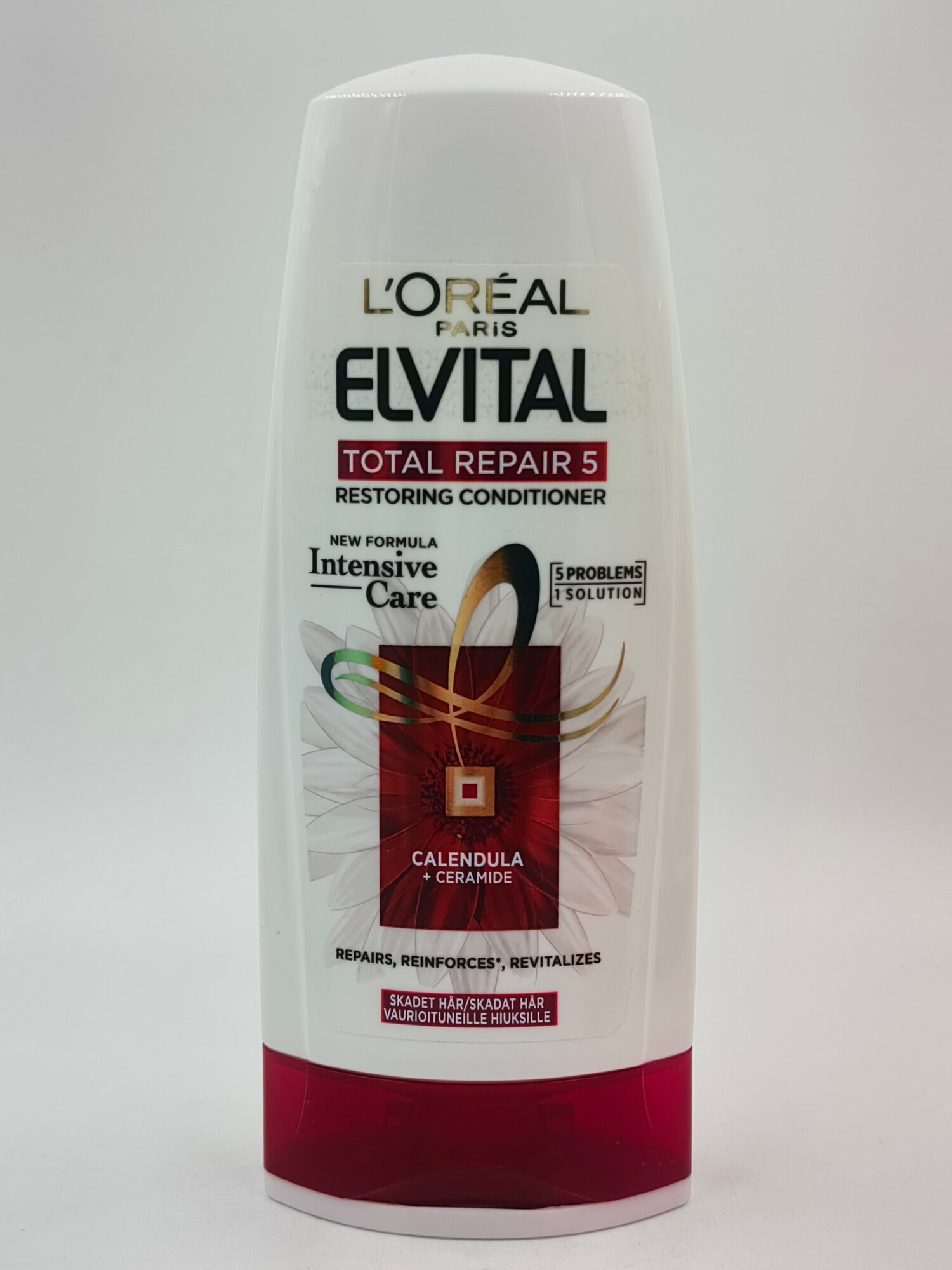Восстанавливающий кондиционер ElvitalTotalRepair 5 с церамидами и календулой для поврежденных волос 200 мл (Франция)